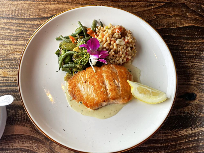 Perfectly seared salmon with seasonal vegetables and Israeli couscous&mdash;proof that sometimes the simplest preparations let great ingredients sing their own delicious song.