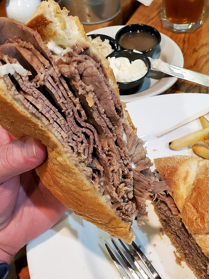 Behold the roast beef sandwich in its natural glory. Stacked higher than your weekend plans, it's a testament to the beauty of simplicity done absolutely right.