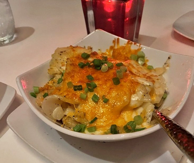 Not your grandmother's potatoes (unless she was a culinary genius). Cheese bubbling over tender layers creates a side dish worth fighting for.