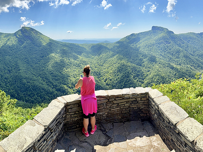 The stone viewing platform frames the vista perfectly, like nature's own IMAX theater without the overpriced popcorn.