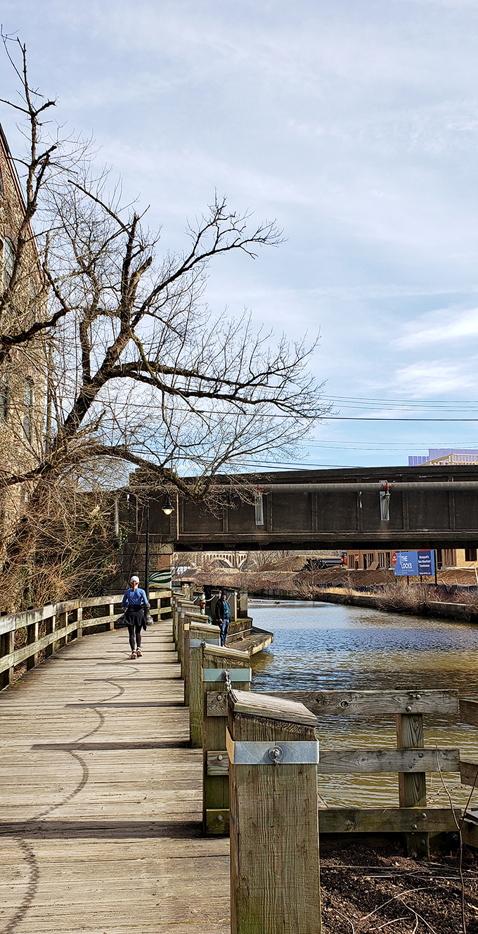 The Schuylkill River boardwalk offers a peaceful escape just steps from urban bustle. Nature and city life coexist in a harmony that defines Manayunk's special character.