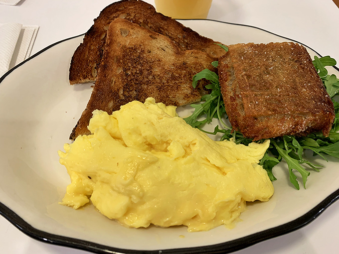 Scrambled eggs so fluffy they look like they might float off the plate, paired with toast that's achieved that perfect golden-brown glow.
