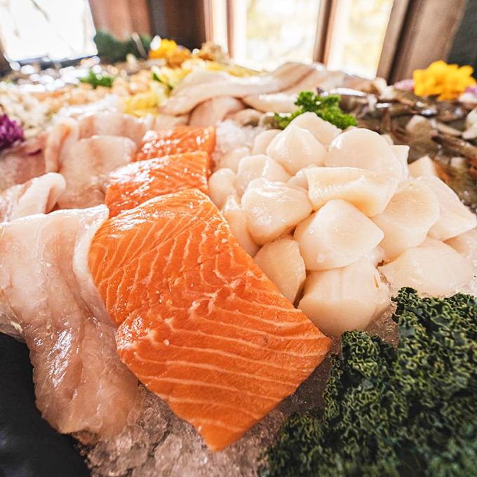 Fresh scallops and salmon arranged with the care of a jewelry display. The ocean's finest gems, no diving required.
