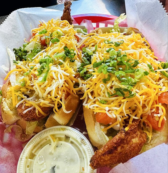 The seafood equivalent of hitting the jackpot &ndash; crispy fish nestled in soft rolls, crowned with cheese and fresh scallions.