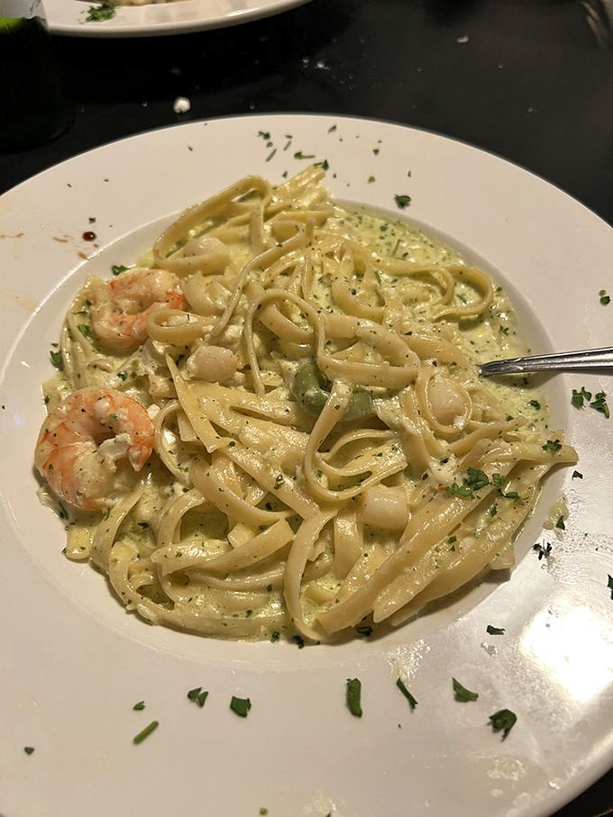 Seafood Alfredo that makes you wonder why mermaids don't weigh 300 pounds. Creamy pasta paradise with treasures from the sea.