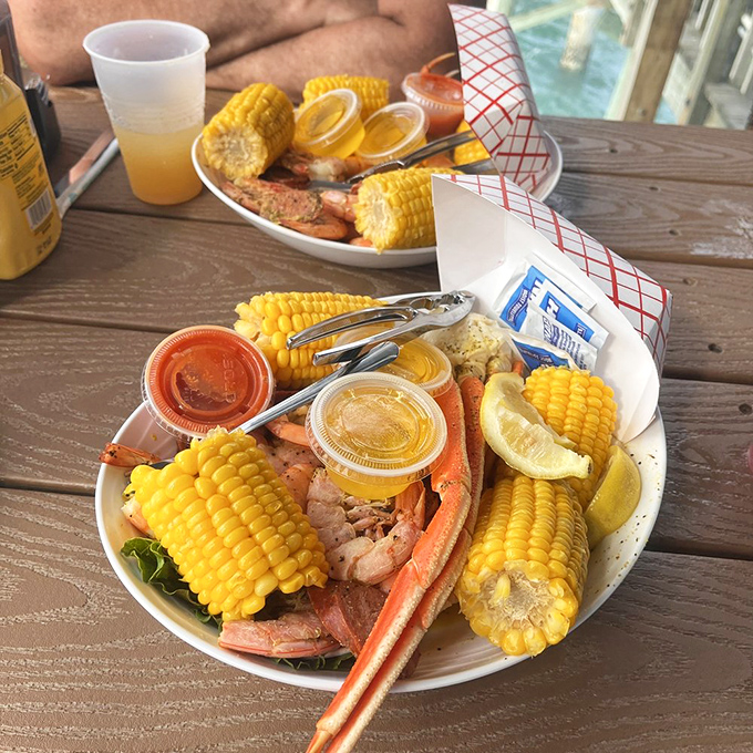 The seafood combo that answers the eternal question: "Why choose one when you can have it all?" Ocean bounty meets corn-on-the-cob perfection.