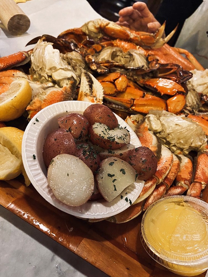 This seafood platter isn't just dinner – it's a commitment. Red potatoes and crab legs creating the seafood equivalent of a treasure chest.