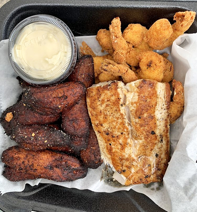 The seafood platter that ruins all other seafood platters. Perfectly grilled fish, crispy fried shrimp, and sweet plantains create a trifecta of deliciousness.