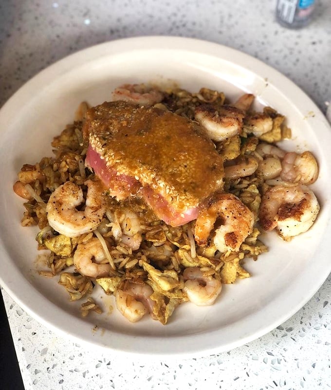 Not your average tuna dish! This Shanghai-style creation sits atop fried rice like a culinary crown jewel of the sea. 