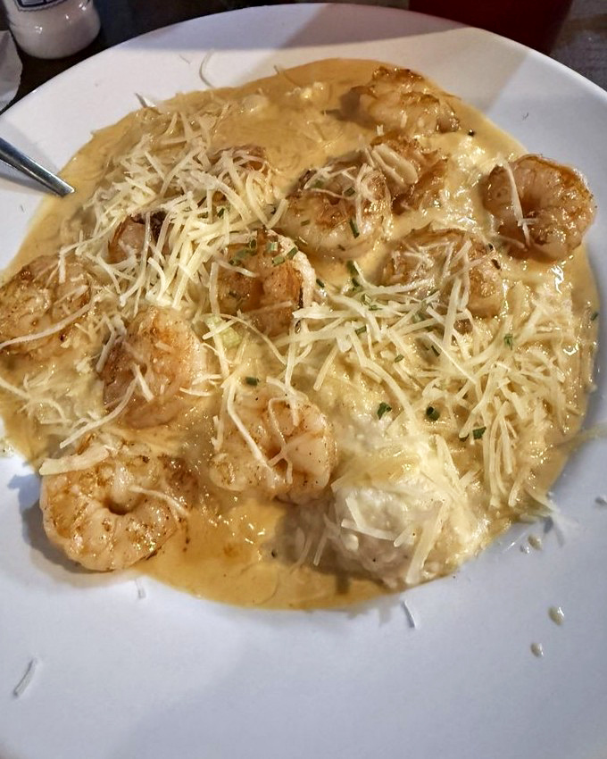These shrimp and grits aren't just a dish—they're a Southern love letter written in cream sauce and parmesan. Pure comfort in every spoonful.