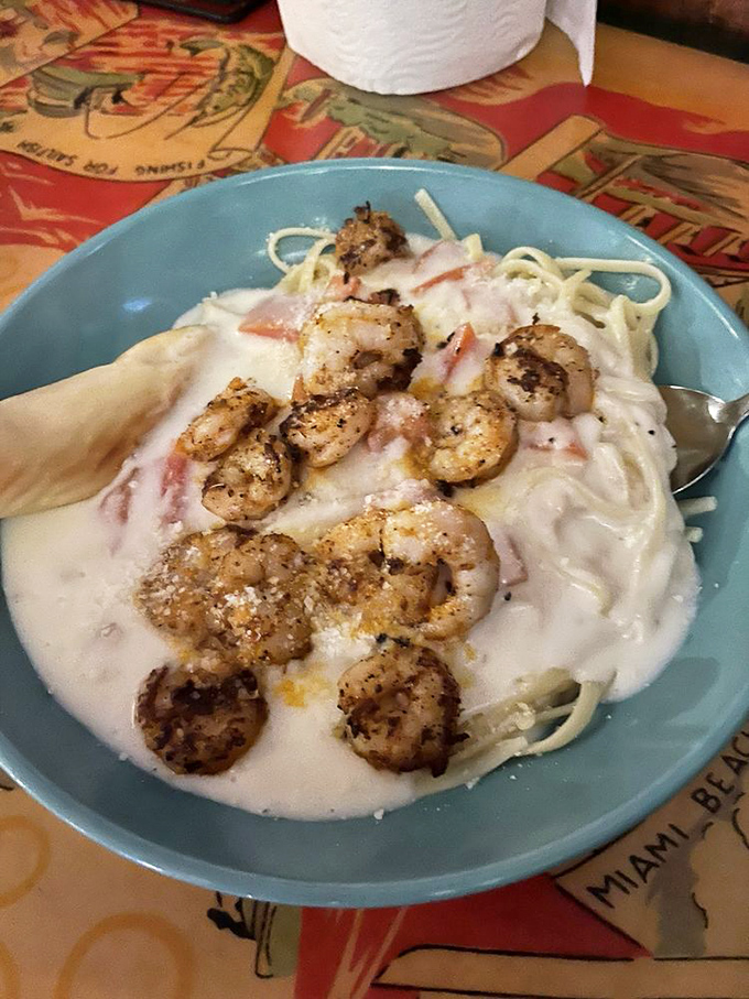 Shrimp scampi pasta where the seafood is the star, not just a supporting actor. Those plump shrimp look like they're lounging in a creamy hot tub.