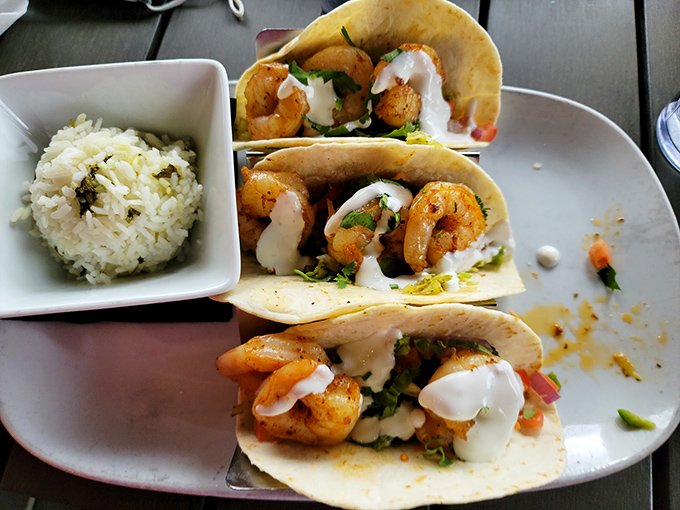 These shrimp tacos bring a taste of coastal bliss to the heartland, complete with fresh garnishes and perfect seasoning.