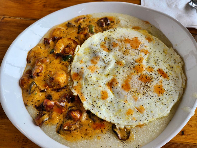 A perfectly cooked egg crowns this skillet like the breakfast equivalent of a royal coronation. The cheese pull potential is magnificent.
