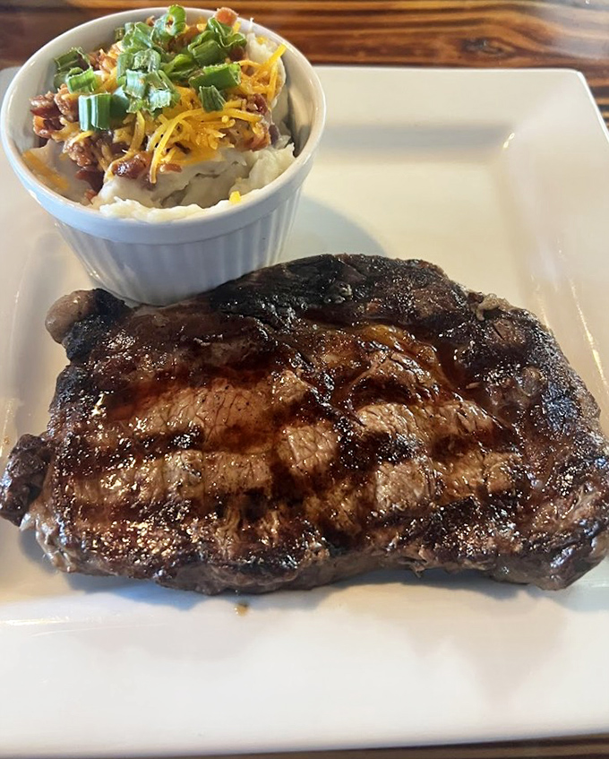 A steak marked by fire, paired with loaded potatoes that could be a meal themselves. This is why pants with elastic waistbands exist.