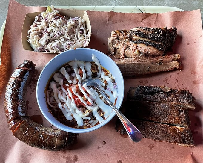 The BBQ sampler that makes vegetarians question their life choices. A symphony of smoke, spice, and everything nice on butcher paper.