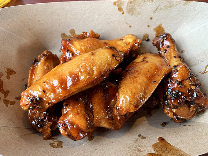 Wings that have clearly been introduced to smoke and fire in the most delicious way possible. Finger-licking isn't optional&mdash;it's mandatory.