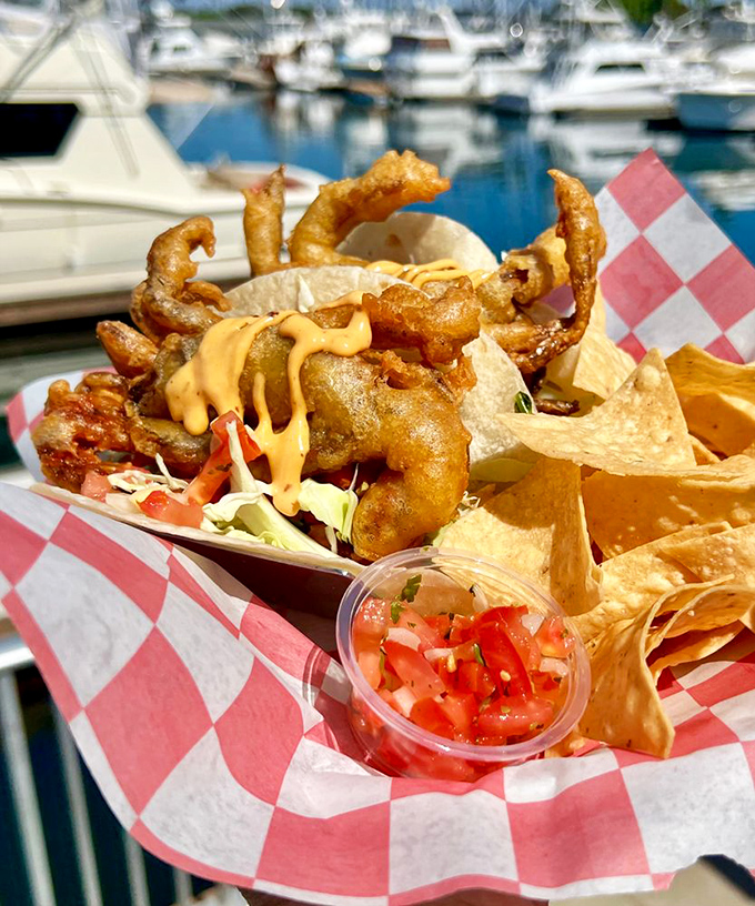 Soft shell crab tacos with marina views &ndash; the kind of dish that makes you question why you'd ever eat anything else near the ocean.