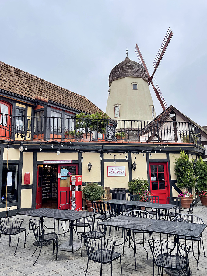 The windmill at Solvang might be the most photographed landmark in the valley, but it's the outdoor dining beneath it that creates the real European magic.