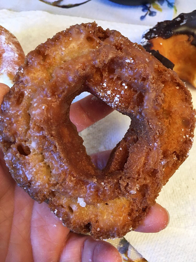 This isn't just fried dough&mdash;it's an engineering marvel of crispy exterior yielding to pillowy interior, glistening with a glaze that reflects your delighted expression.