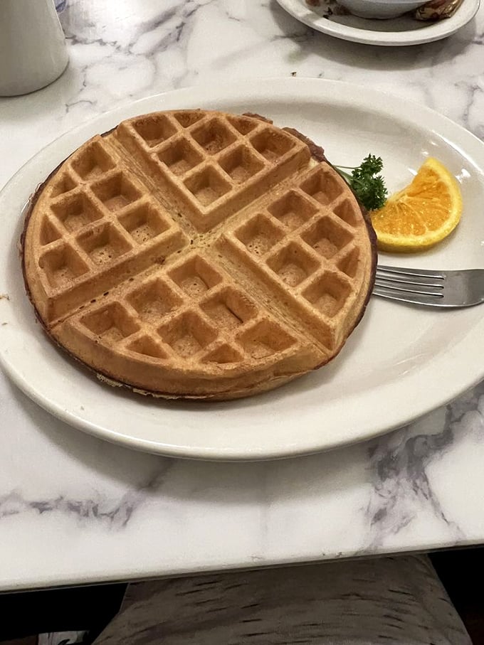 A waffle so perfectly formed it looks like it should be in a museum, but tastes like it should be in your mouth immediately.