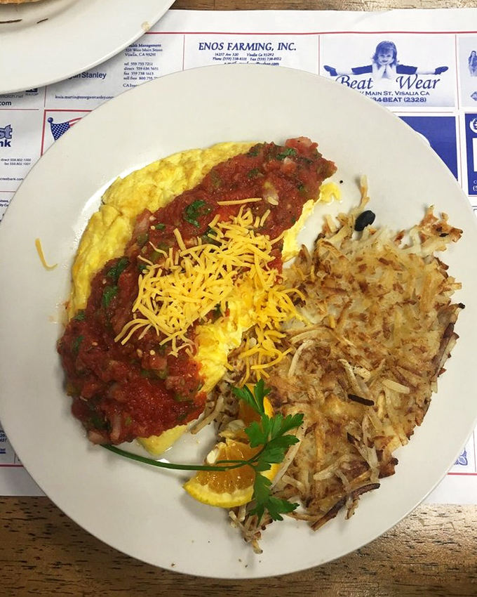 When an omelet meets salsa, cheese, and perfectly crispy hash browns, Monday mornings suddenly don't seem so terrible after all.