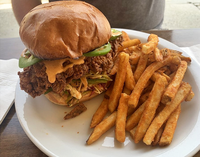 This isn't just a chicken sandwich; it's a masterclass in crunch, spice, and everything nice. The golden fries are just a bonus.