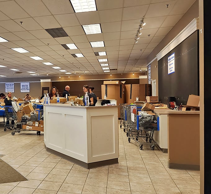 Command central for bargain operations. The staff keeps the treasure hunt organized while shoppers plot their bin-diving strategies.