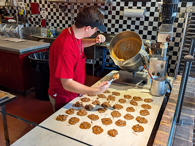 The ancient art of cookie-making on display, where each golden disc is crafted with care before becoming someone's "I deserved this after all that shopping" reward.