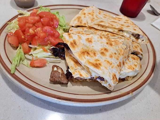 This quesadilla isn't just folded and grilled—it's transformed into a perfect harmony of melted cheese and steak that makes you wonder why you'd eat anything else.