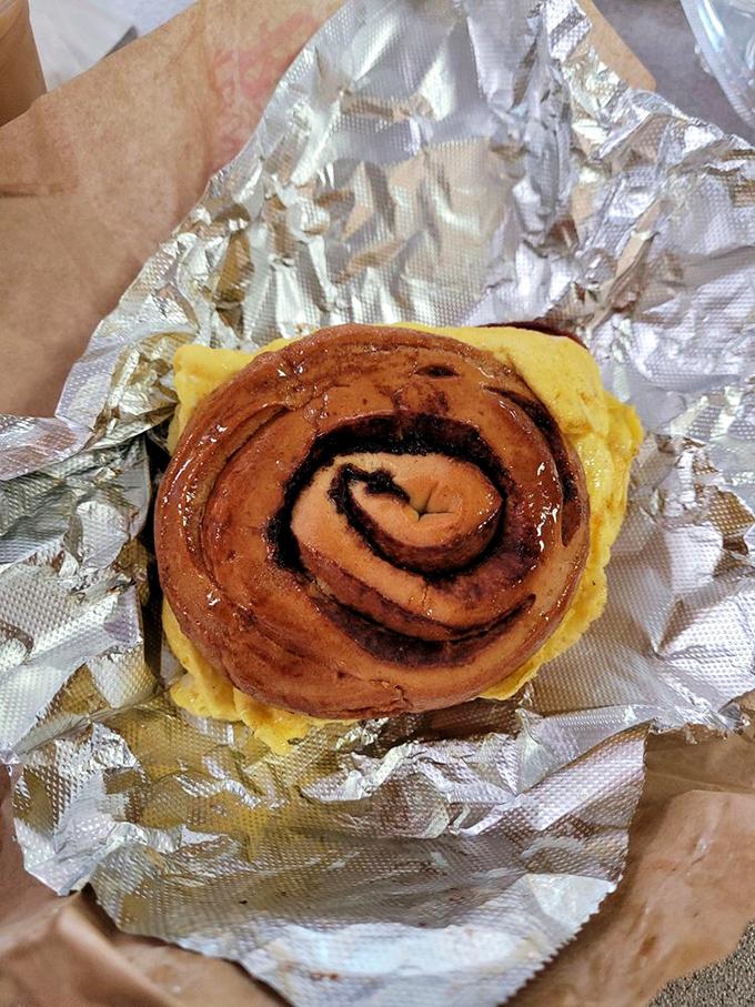This cinnamon roll isn't just glistening with sugary promise &ndash; it's practically winking at you from its foil wrapper, saying "diet starts tomorrow."