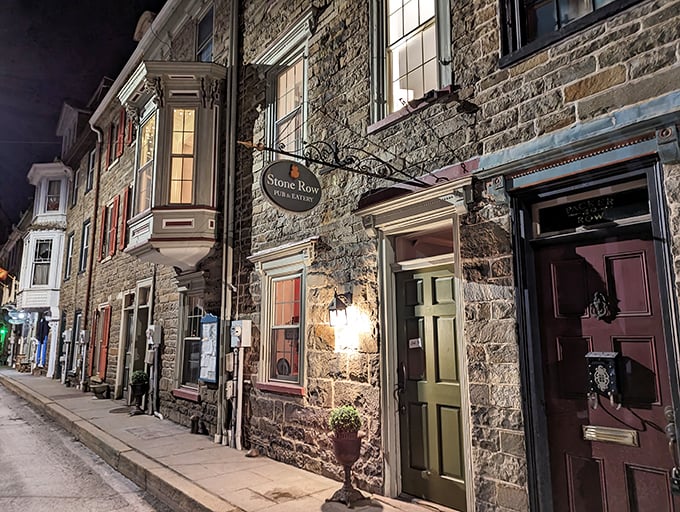 Stone Row Pub & Eatery's evening glow beckons like a culinary lighthouse, promising warm stone walls inside and even warmer hospitality on your plate.