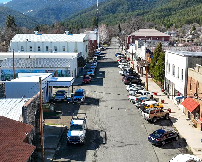 Aerial view of Etna reveals its perfect nestling between mountains and meadows. Nature's version of a protective hug.