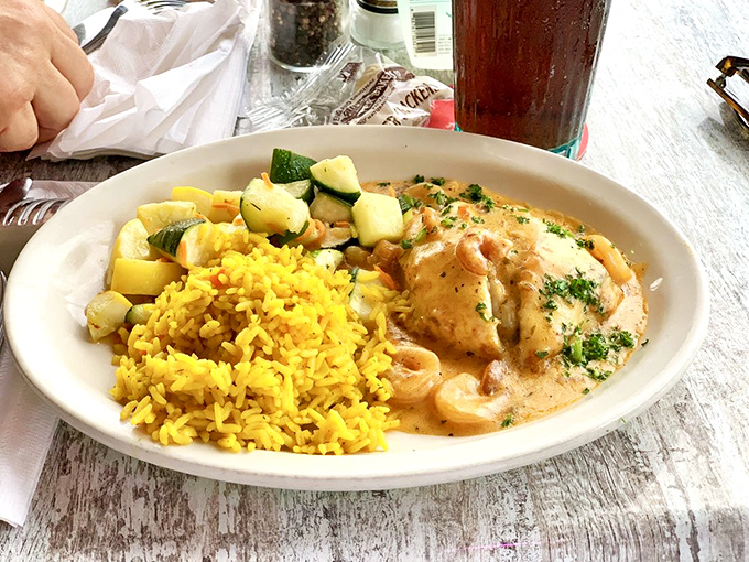 This seafood dish isn't just dinner &ndash; it's edible artwork, where creamy sauce meets tender fish and colorful vegetables in perfect harmony.