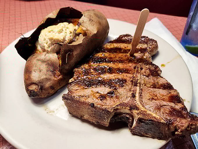 This T-bone doesn't just share a plate with a baked potato&mdash;they're having a full-blown flavor summit meeting.