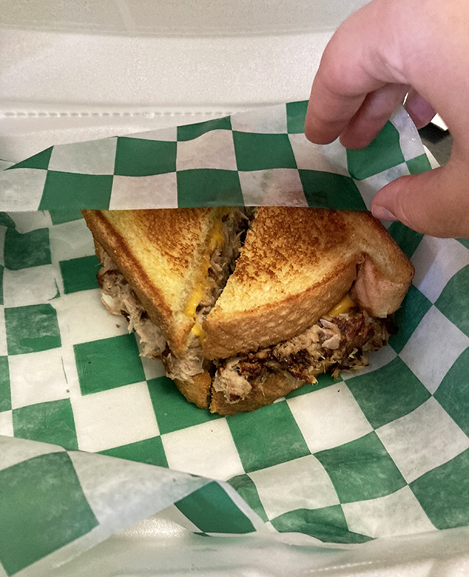 This isn't just a sandwich; it's architecture. Layers of melty cheese and savory filling with those legendary hash browns standing guard alongside.