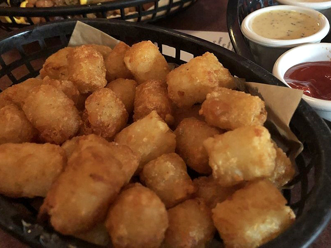 Tater tots: the food that proves adulthood doesn't mean abandoning childhood joys. These golden nuggets of potato perfection might be worth the trip alone.