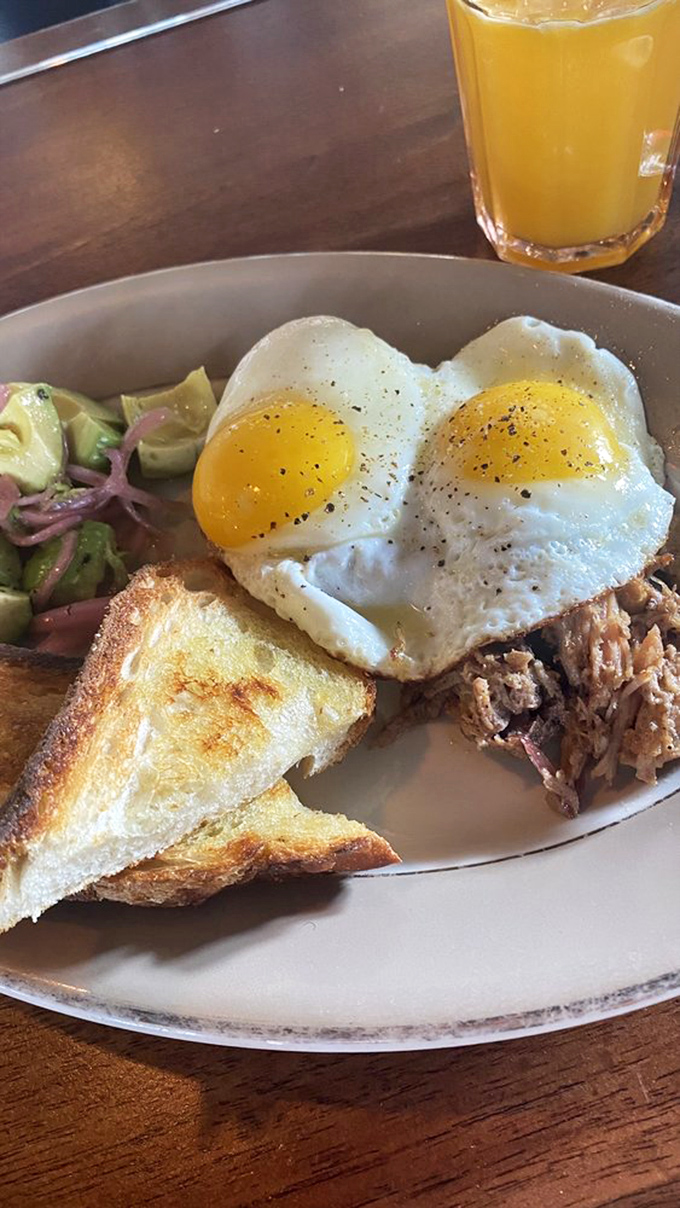 When breakfast means business: sunny-side-up eggs crowning slow-roasted meat alongside avocado and toast. Monday morning never stood a chance.