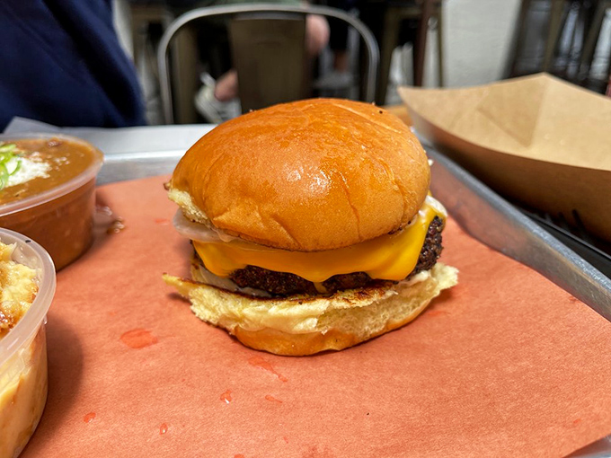 This isn't just a burger&mdash;it's architecture. The melted cheese cascades down the patty like a yellow waterfall of happiness.