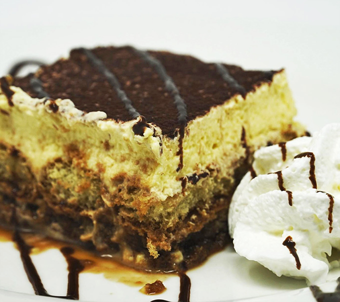 This tiramisu has layers like a good story—coffee-soaked ladyfingers, mascarpone cream, and a dusting of cocoa that whispers "one more bite."