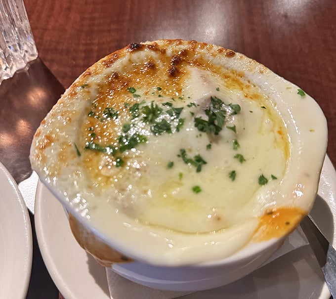 This tomato bisque isn't just soup&mdash;it's a warm hug in a bowl, topped with fresh herbs and enough cheese to make Wisconsin proud. 