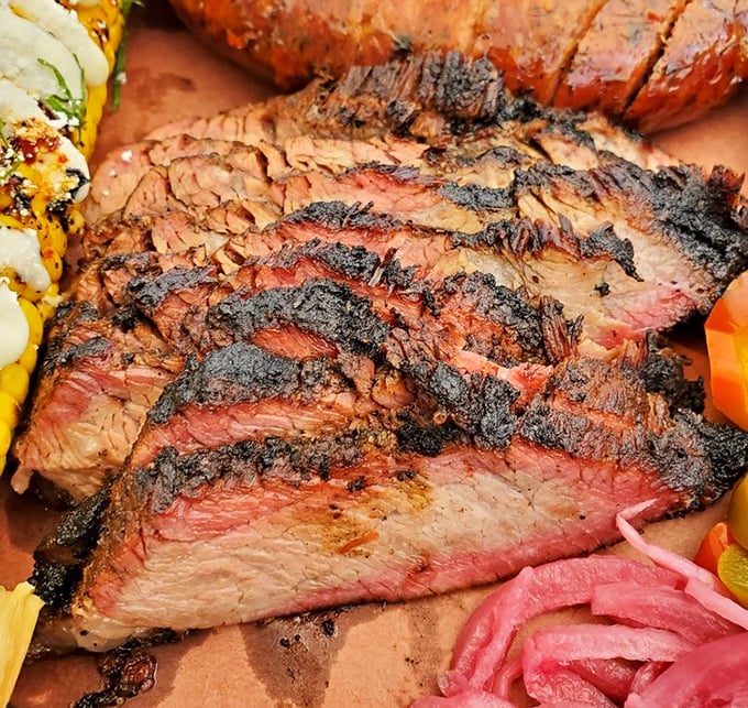 Tri-tip with that perfect edge-to-edge gradient of doneness. The pink pickled onions cut through the richness like a well-timed punchline.