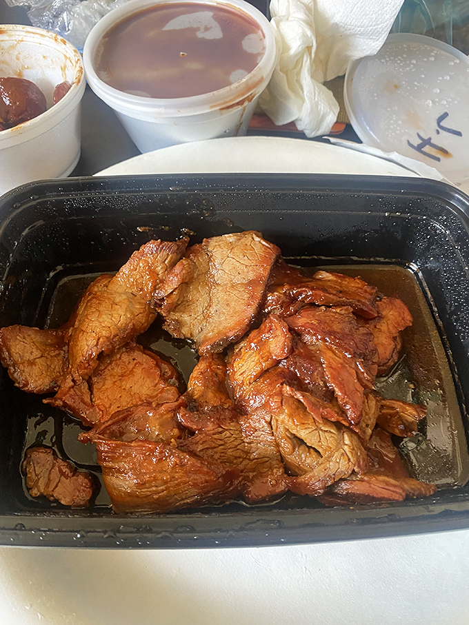 Tri-tip bathing in its own juices like it's at a meaty spa. The tenderness here isn't optional&mdash;it's mandatory.