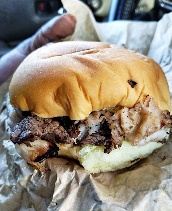 A pit beef sandwich caught in its natural habitat &ndash; wrapped in paper, ready to be devoured, with that telltale pink smoke ring that separates the pros from the pretenders.