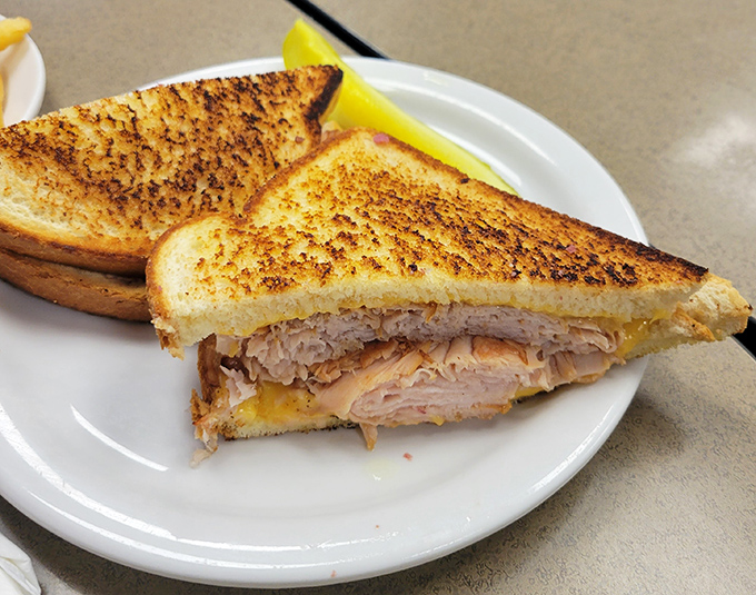Even the turkey sandwich refuses to be modest here. Perfectly toasted bread embracing layers of meat that would make a Thanksgiving table jealous.