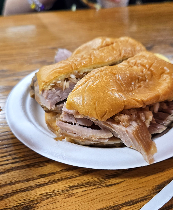 The sliced sandwich&mdash;where each piece of pork tells its own nine-hour smoke story between two perfectly ordinary buns.