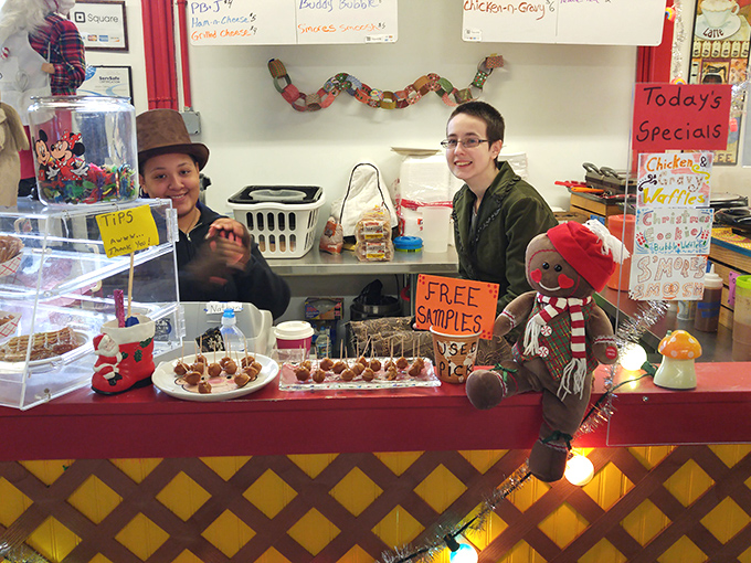 Free samples: the universal language of marketplace hospitality. These sweet treats entice passersby with the promise of homemade goodness worth coming back for.
