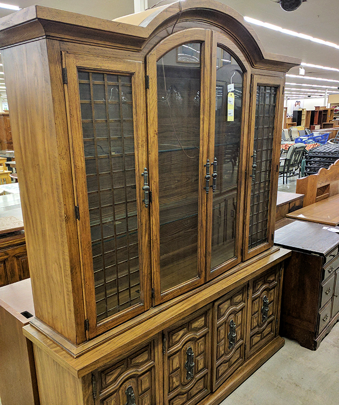 Not just a china cabinet – it's a wooden time machine to Sunday dinners past, with leaded glass that's witnessed countless dessert debates.