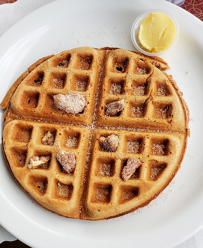 A waffle that's achieved the impossible trifecta: crispy exterior, fluffy interior, and the perfect vessel for that melting pat of butter.