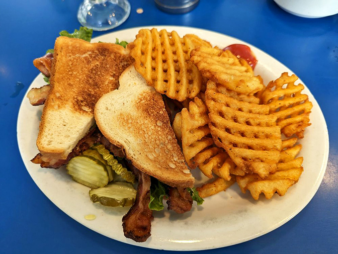 The BLT sandwich with waffle fries&mdash;because sometimes lunch should look like it's wearing a tuxedo. Those crispy ridges are nature's ketchup holders.