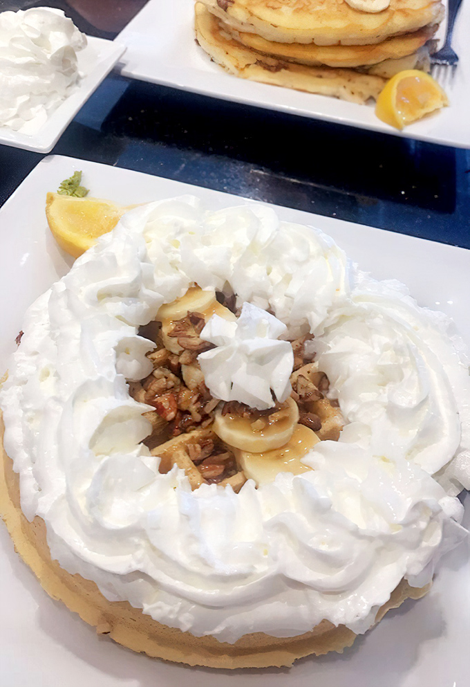 Crispy-edged waffles with perfect pockets, ready to cradle syrup like edible architecture designed for happiness.